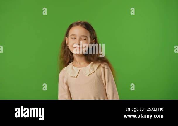 Children emotions concept. Little girl child looks around and waves ...