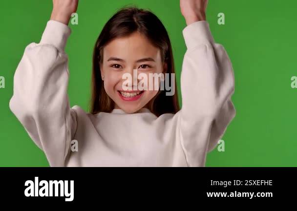 Children emotions concept. Asian girl child with happy face looks at ...