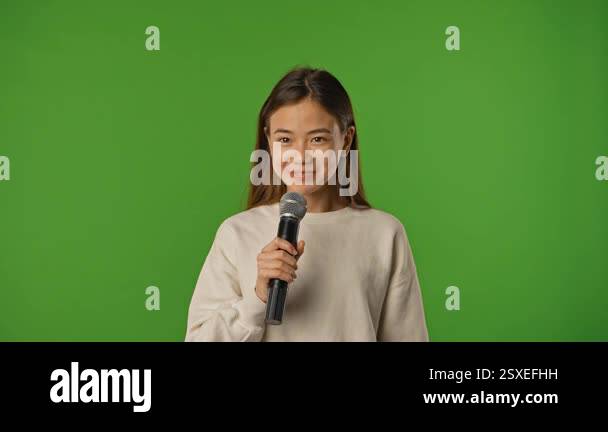 Children emotions concept. Asian girl child singing song in karaoke ...