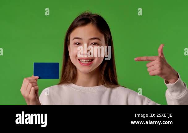 Children emotions concept. Asian girl child holding advertisement card ...