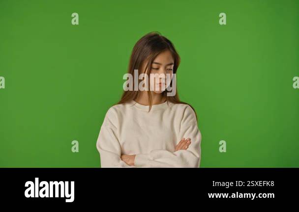 Children emotions concept. Asian girl child with crossed arms and angry ...