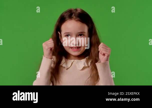 Children emotions concept. Little girl child with happy face looks at ...