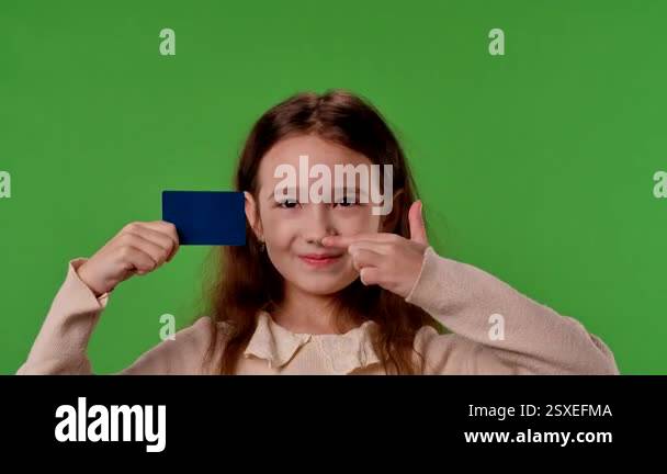 Children emotions concept. Little girl child holding advertisement card ...