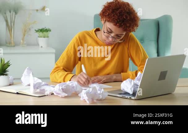 Start up business concept. Sad african business woman writing document ...
