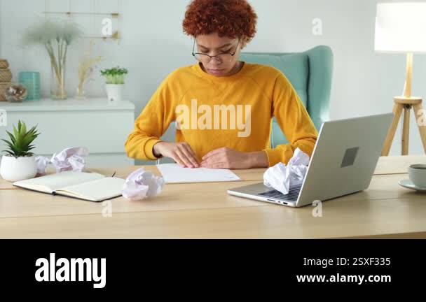 Start up business concept. Sad african business woman writing document ...