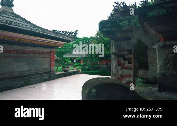 A serene view of traditional Balinese architecture featuring stone ...