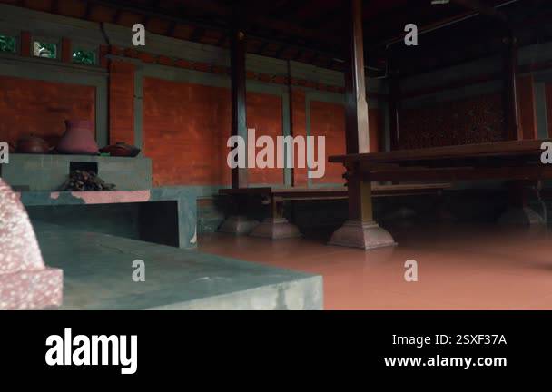 A serene interior of a traditional room featuring wooden pillars, stone ...