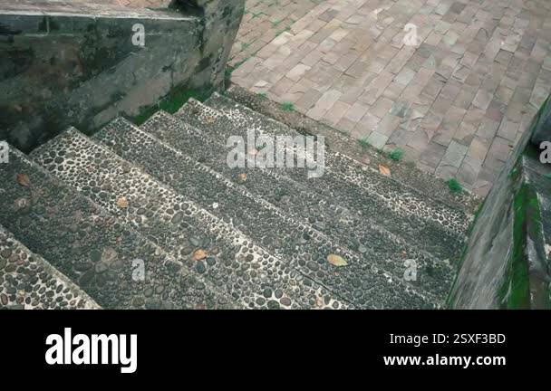 A view of stone stairs leading down, with a textured surface made of ...