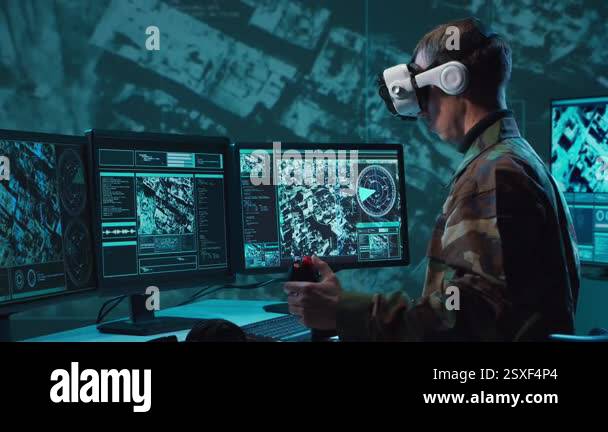 Dramatic scene of a soldier in a dimly lit military control room ...