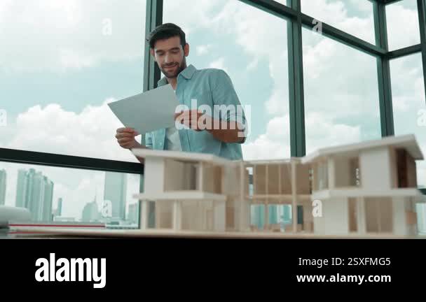 Professional architect engineer reading blueprint while inspect house ...