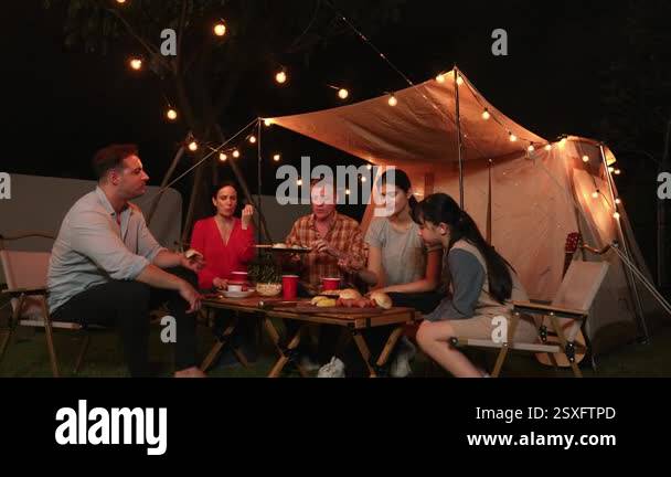 Family together celebrate holiday in garden. Family member gathering ...