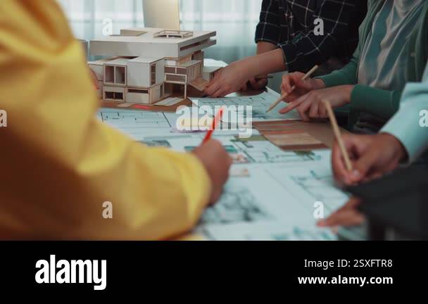 A vibrant collaborative design session showcases architects and clients ...