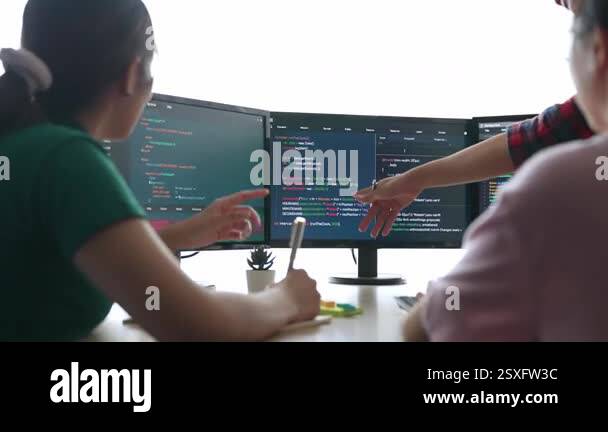 Back end software developer engineer for computer programming working together on debugging ...