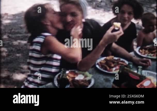 playful family finds a picnic table at roadside rest stop for lunch on ...
