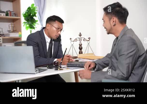 Businessman and lawyer talking and making a contract together Signing a ...