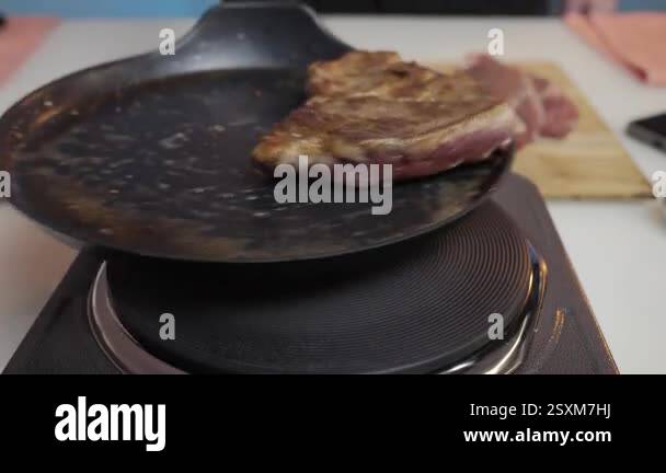 Imagine a delicious steak sizzling in a skillet, its perfect sear and ...