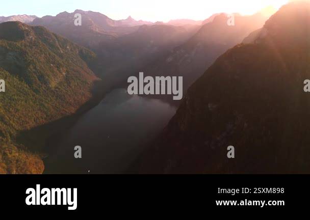 Aerial view of Koenigssee in Germany, showcasing stunning fall colors and golden sunset over ...