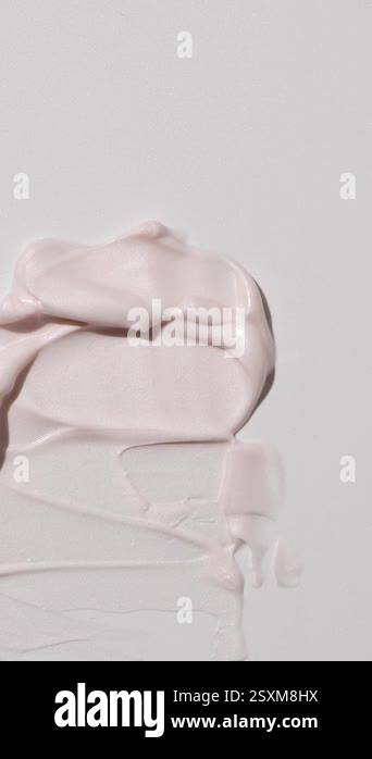 Swatches of Pink cream highlighter on a white background. Spatula ...