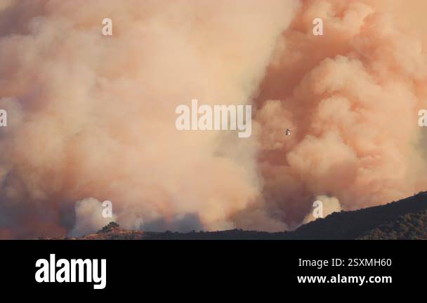 A massive and aggressive wildfire near Los Angeles threatens homes and ...