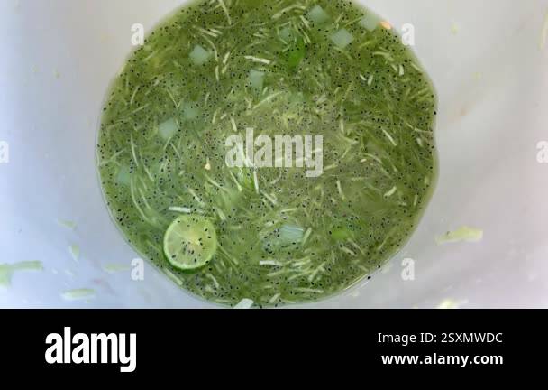 Homemade Iced melon syrup with grated melon fruit, jelly, basil seeds ...