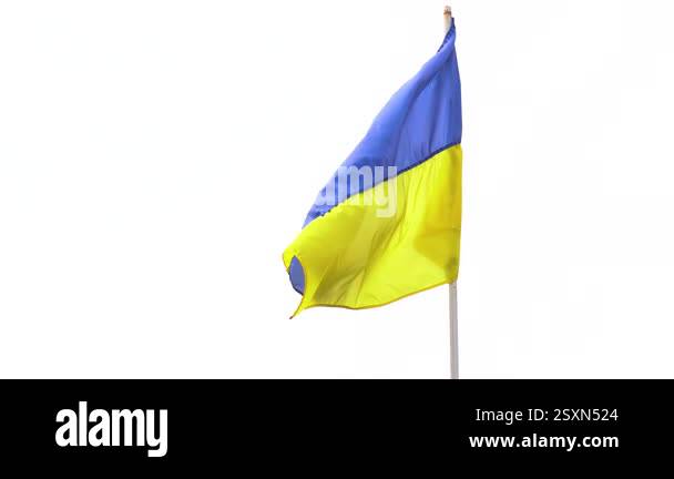 A vibrant Ukrainian flag flutters gracefully in the wind, showcasing ...