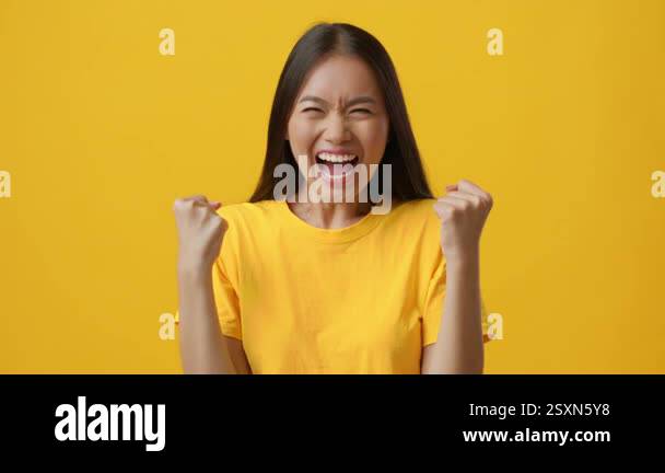 Man express excitement and victory through gestures and smiles ...