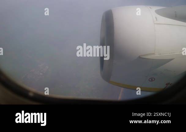 View From Airplane Window Focusing on Engine While Cruising Through Sky ...