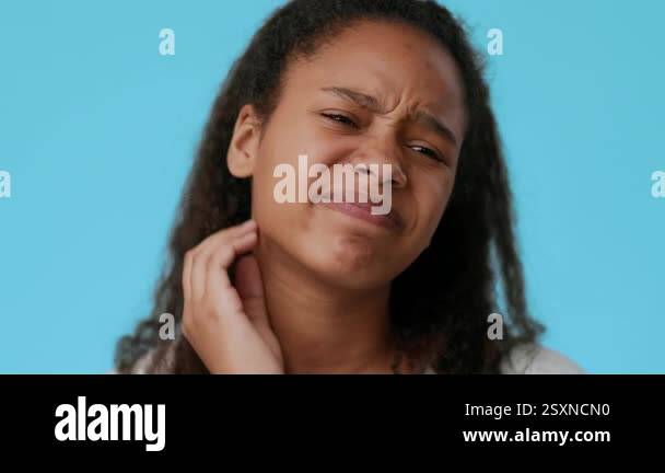A pretty African American adolescent girl shows a thoughtful expression ...