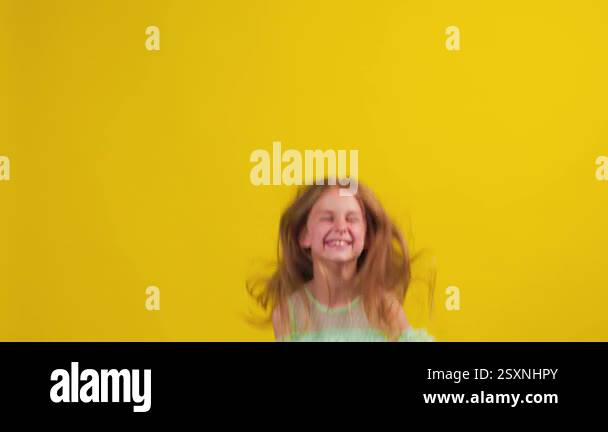 Happy kid girl in the blue dress jumping in studio. cute children ...