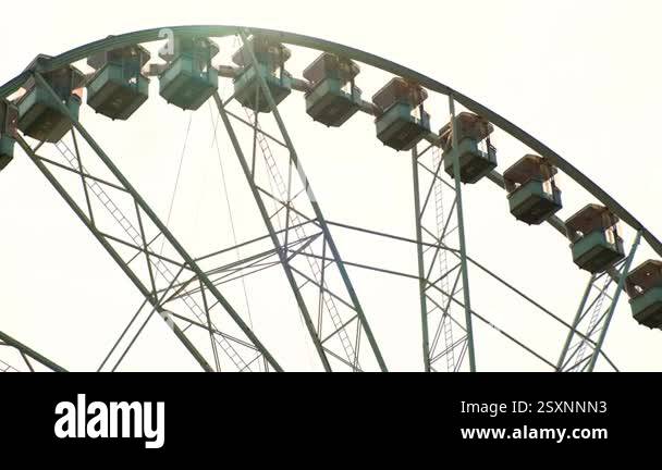 A beautiful closeup view of a Ferris wheel featuring vibrant, colorful ...