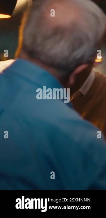Vertical Screen: Heartwarming moment between a young man and an elderly ...