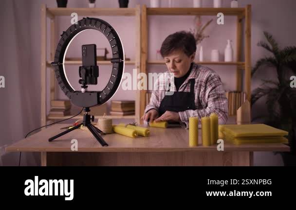 female craftswoman recording video broadcast or learning course ...