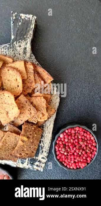 Crispy homemade brown bread chips with seeds and grains, salt, spices ...