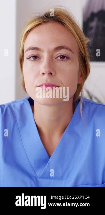 Vertical HD video. POV of young female healthcare worker having a video ...