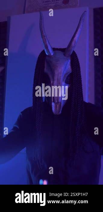 Vertical. The devil monster plays the drums. A mystical man in a scary ...