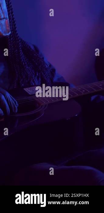 Vertical. The devil monster plays the guitar. A mystical man in a scary ...