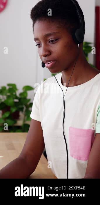 Vertical HD video of young African female customer support manager with ...