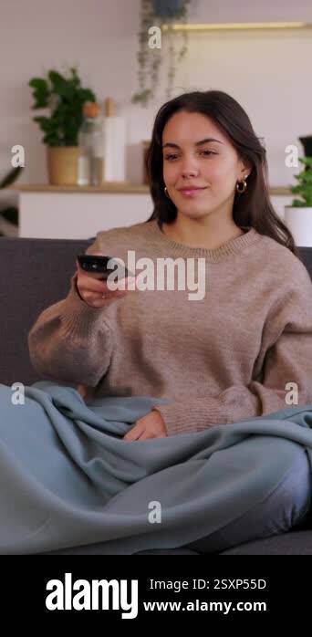 Vertical HD video of young happy gen z woman enjoying her leisure time ...