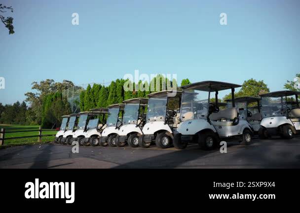 Wide view of Golf carts parked in the designated area at a golf club ...