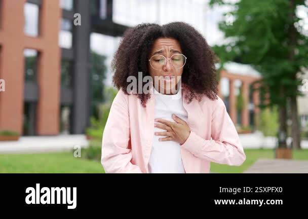 Sick african american female student suffering from chest tension ...