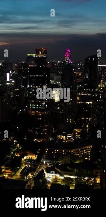 Skyscrapers light up the skyline, high rise buildings illuminated ...