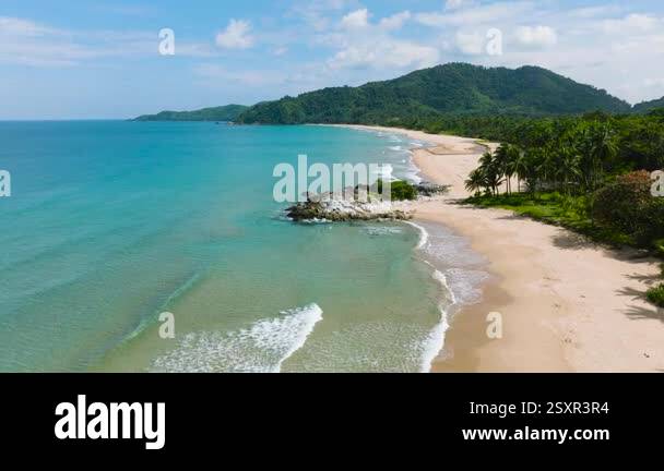 The coastline features a stunning combination of turquoise waters and ...