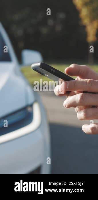 Vertical Video of Businessman controls a self-driving electric car ...