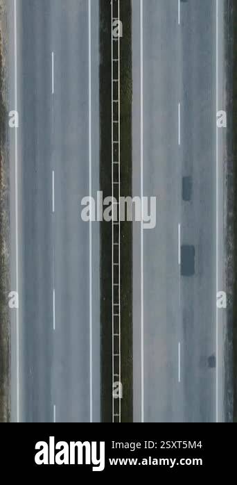 Vertical Format Video of Empty endless autobahn road. Two sided double ...