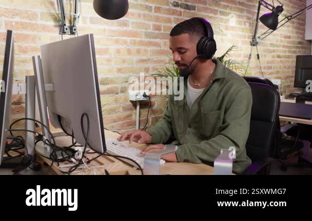 Friendly male customer service representative working remotely from ...