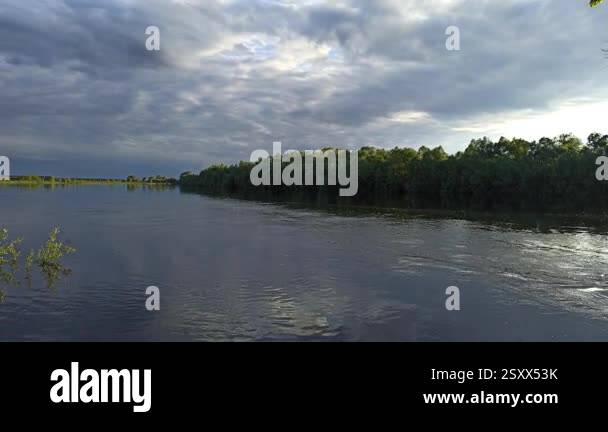 Fast river flowing during spring flood. Seasonal flood of river ...
