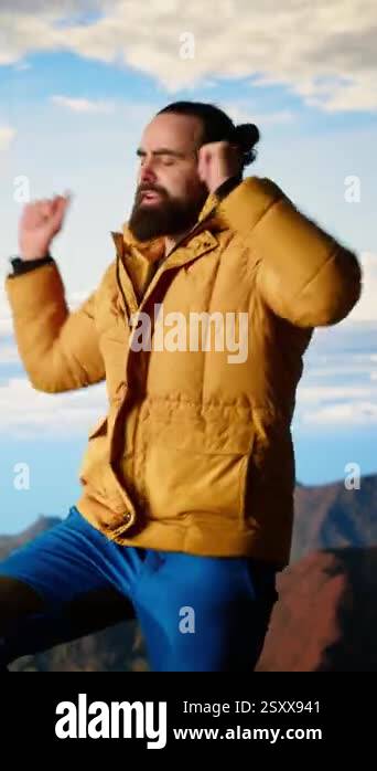 Vertical Video Happy climber cheering and feeling pleased while he ...