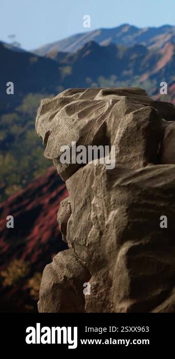 Vertical Video Rugged rocky ledge overlooks a breathtaking mountain ...