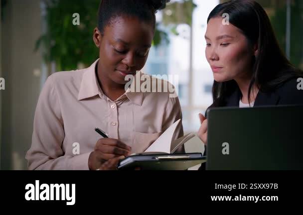 Multiracial businesswomen business partners co-workers colleagues ...