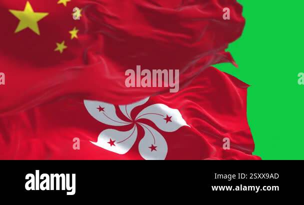 Close-up of Hong Kong and China flags waving isolated on green ...